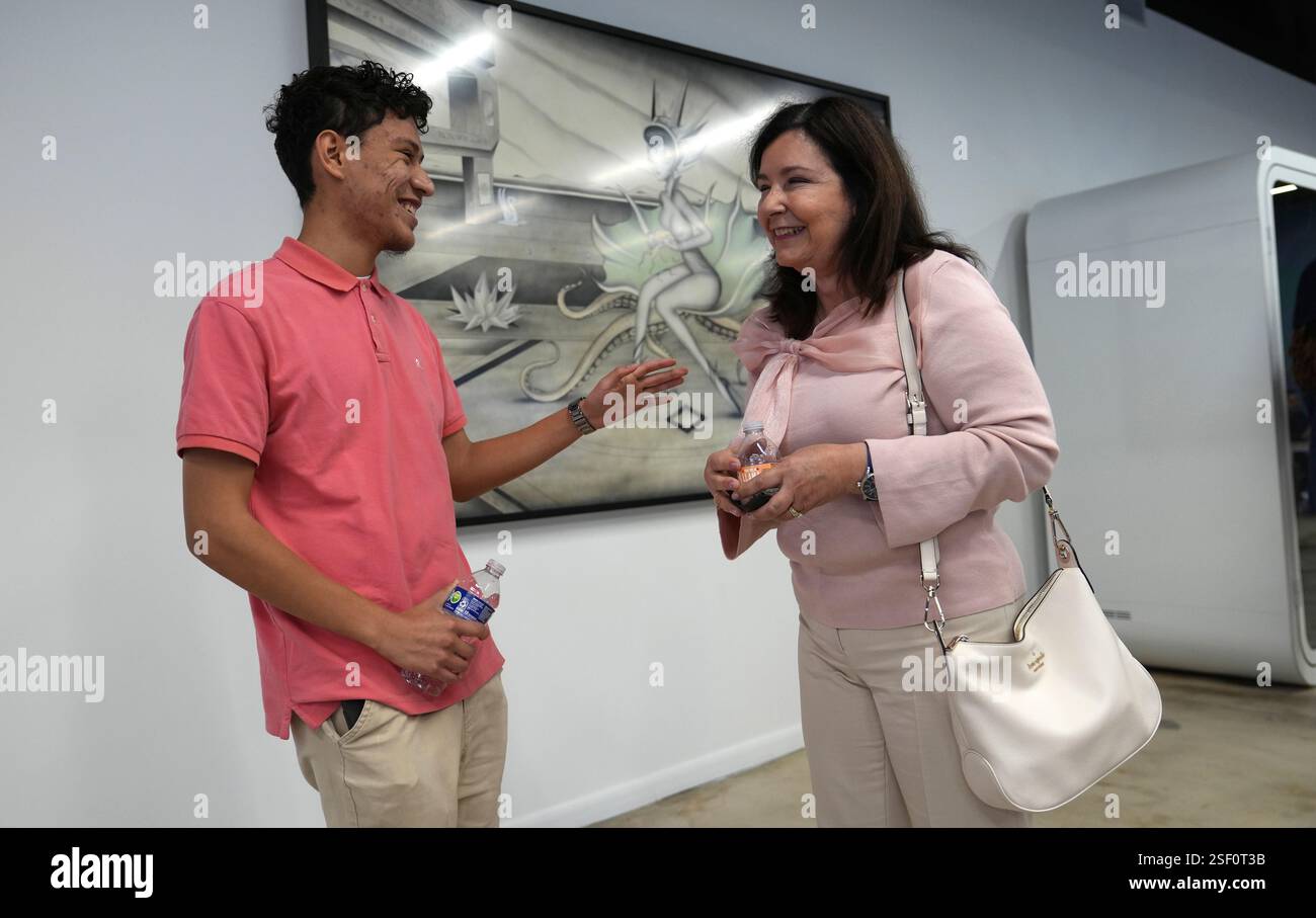 Florida International student Dylan Pravia, left, talks with Vicky Lazo ...