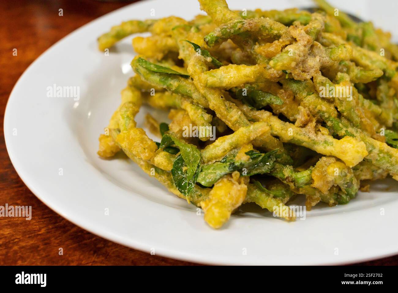 Deep fried french beans with salted duck egg yolk Stock Photo - Alamy
