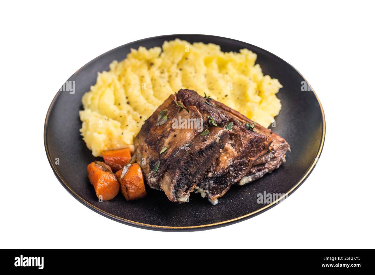 Braised beef short ribs resting on a bed of creamy mashed potatoes ...