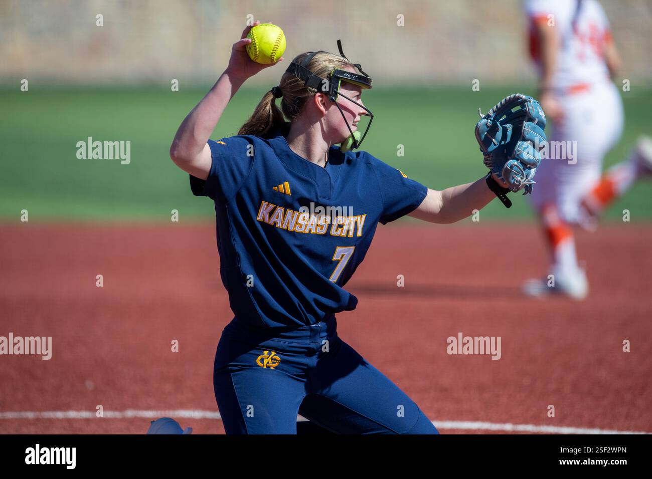 Kansas City pitcher Maddie Parker throws to first base during an NCAA ...
