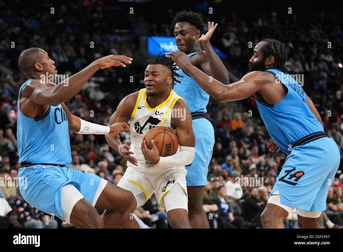 Utah Jazz's Isaiah Collier, center, is defended by Los Angeles Clippers ...