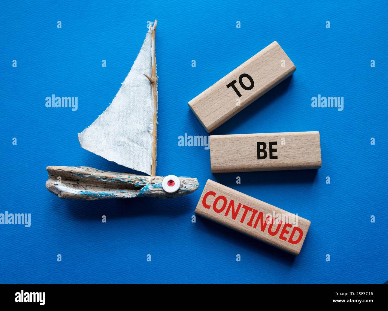 To be continued symbol. Concept words To be continued on wooden blocks ...