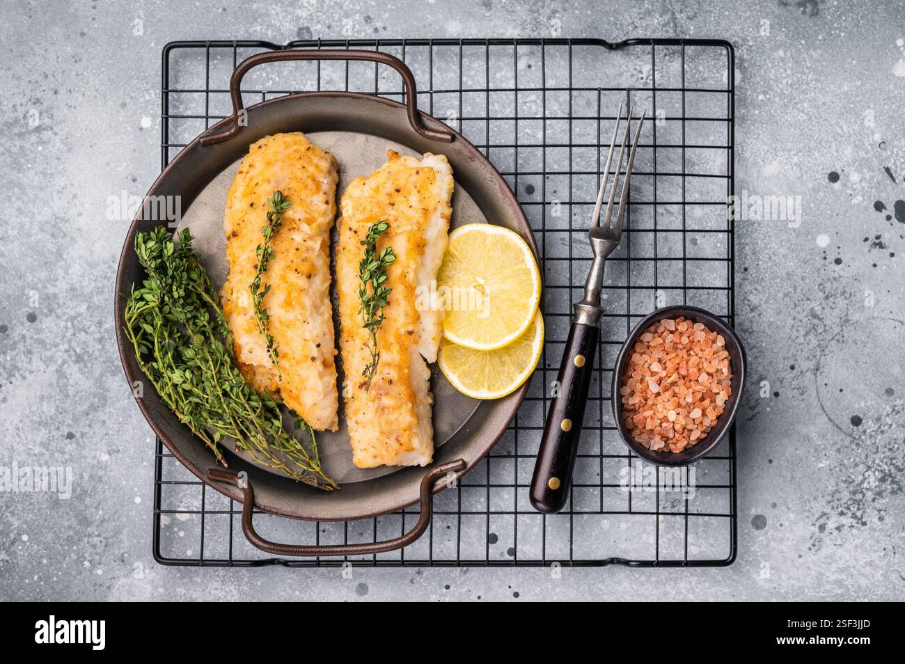 Baked Cod fish fiilet, fried whitefish meat. Grey background. top view ...