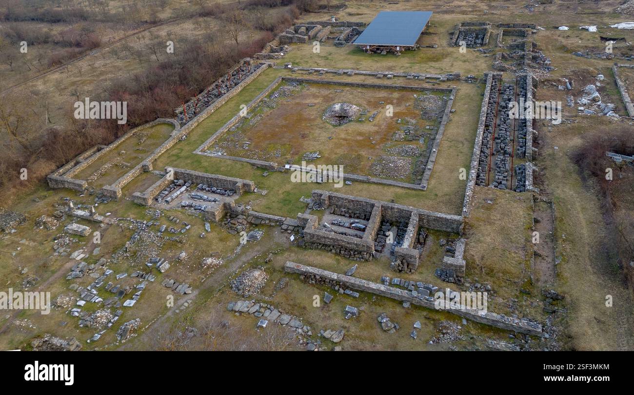 Aerial view of ancient ruins featuring stone structures, walls, and a ...