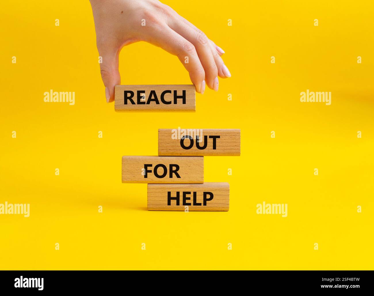 Reach out for help symbol. Wooden blocks with words Reach out for help ...