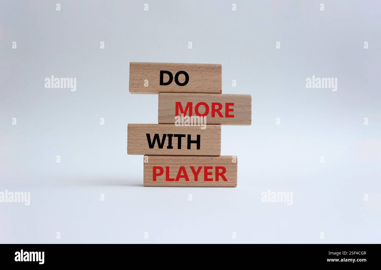 Do more with less symbol. Concept words Do more with less on wooden blocks. Beautiful white ...