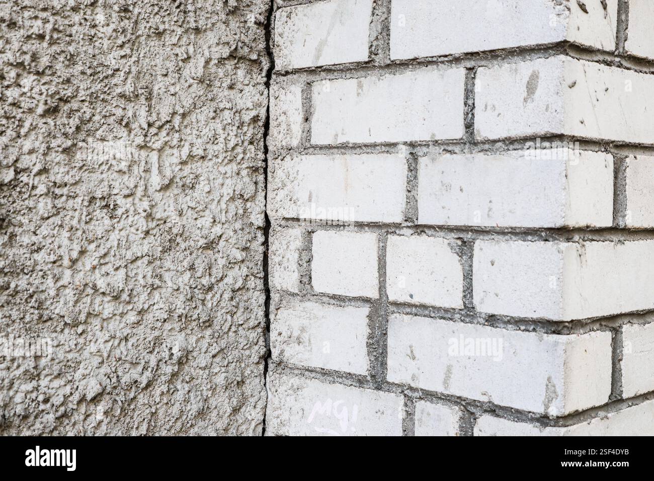 Concrete wall corner with brick wall corner Stock Photo - Alamy