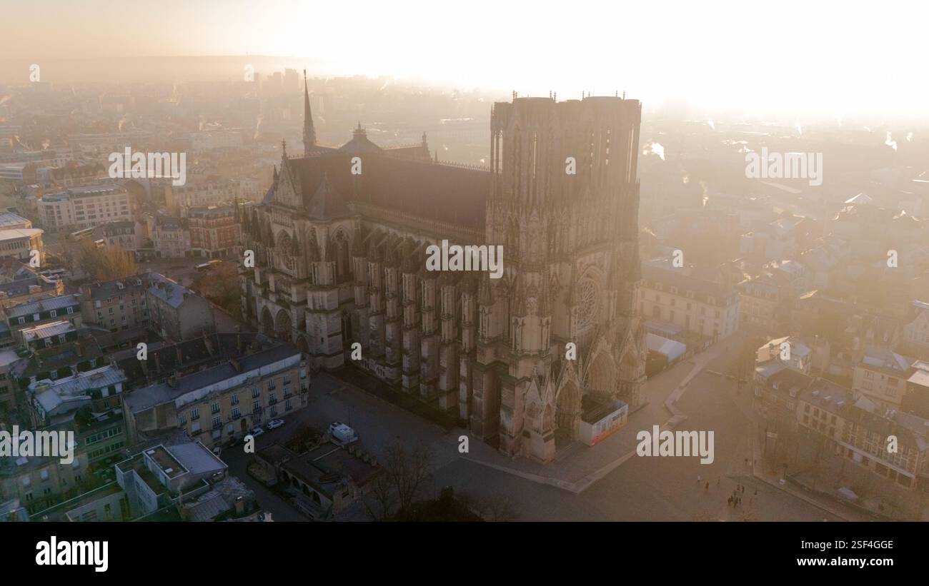 Aerial view of the Reims Cathedral in France during a golden sunrise ...