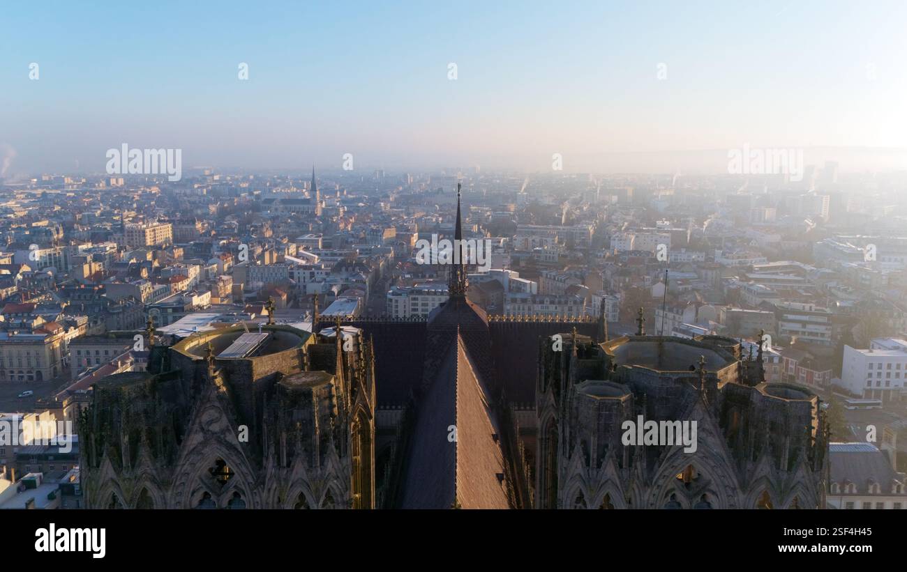 Aerial view of Reims Cathedral's central spire and rooftop, framed by ...