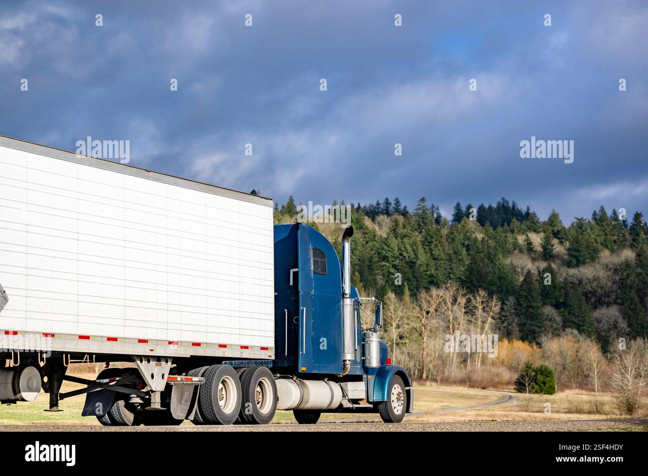 Industrial blue long haul big rig semi truck with extended cab for ...