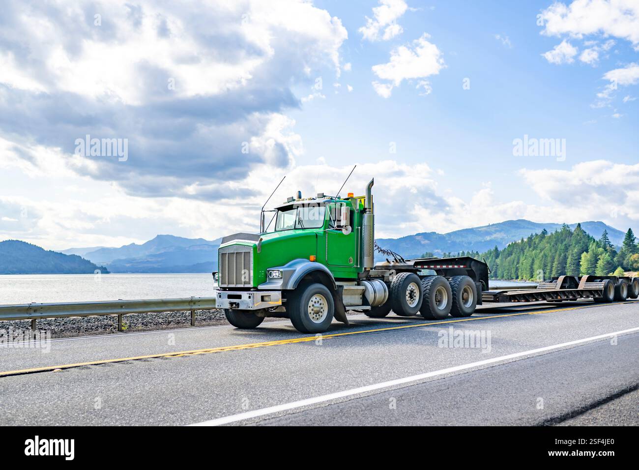 Industrial heavy-duty powerful green day cab big rig semi truck with ...