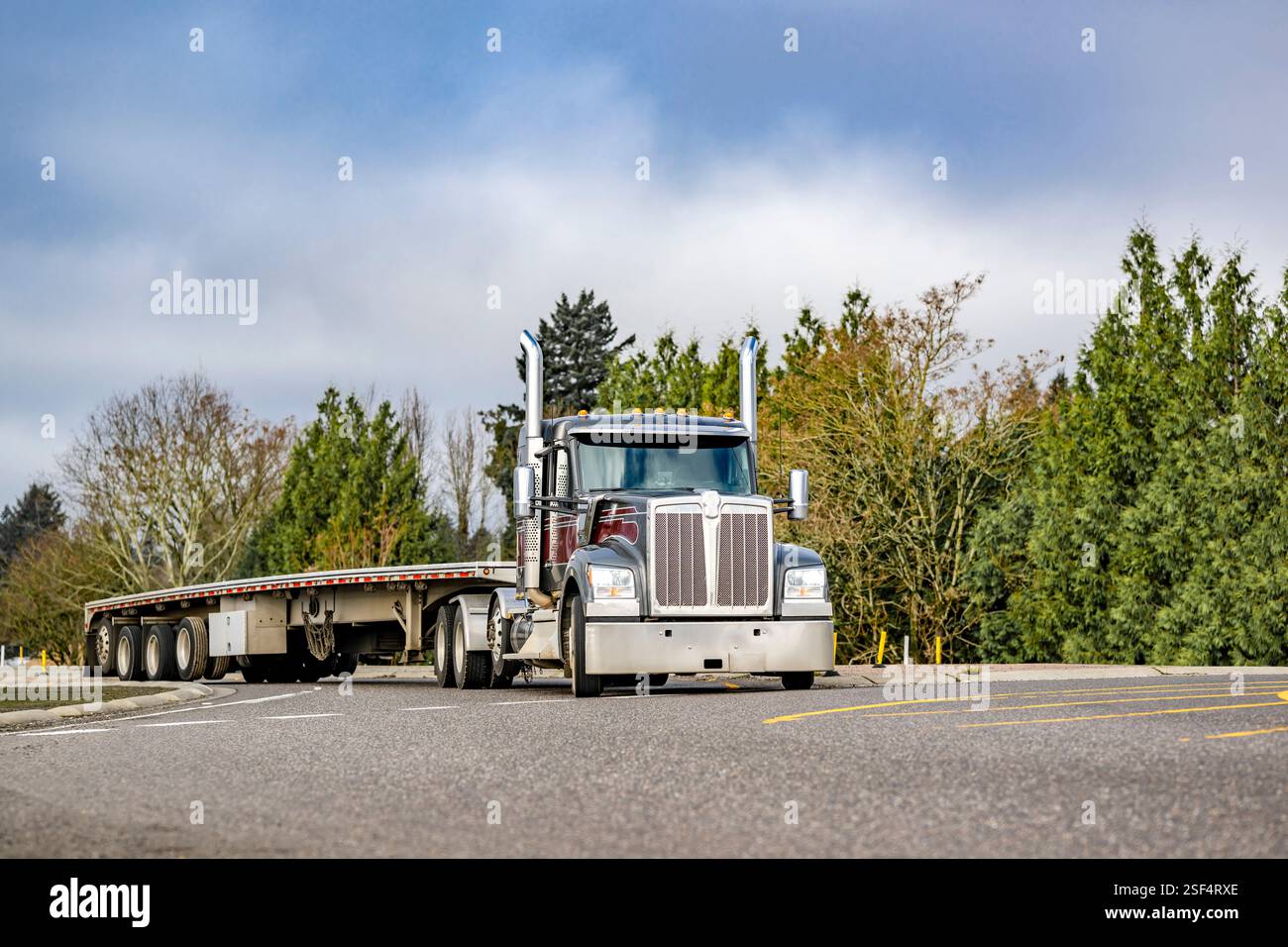 Industrial black big rig long haul semi truck with extended low profile ...