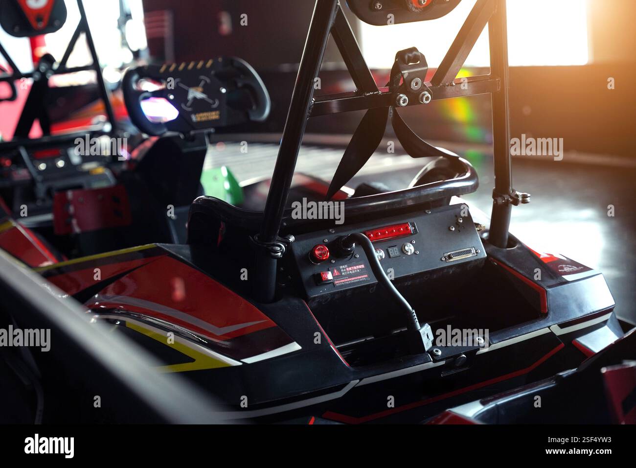 New electric go karts in the modern indoor racing track Stock Photo - Alamy