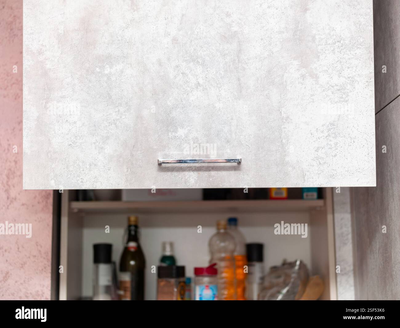 open kitchen cupboard with collection of food stuff, indoor shot Stock ...