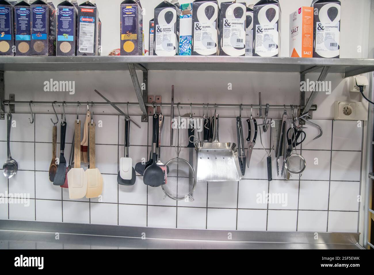 Cooking and restaurant equipment on kitchen wall in restaurant Stock ...