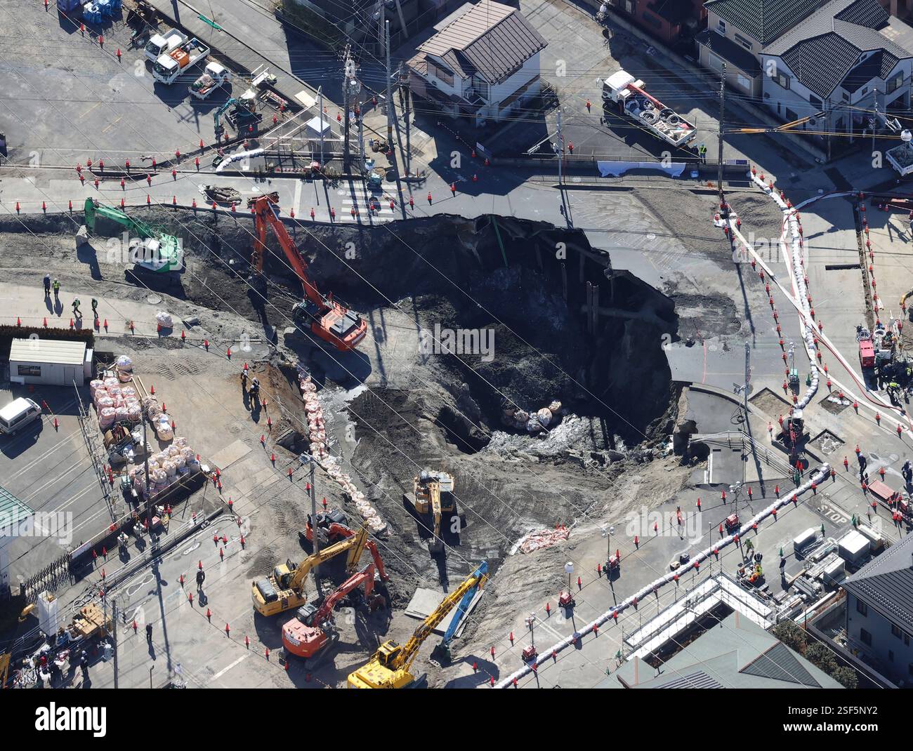 An aerial photo shows the collapsed site of a prefectural road waiting ...