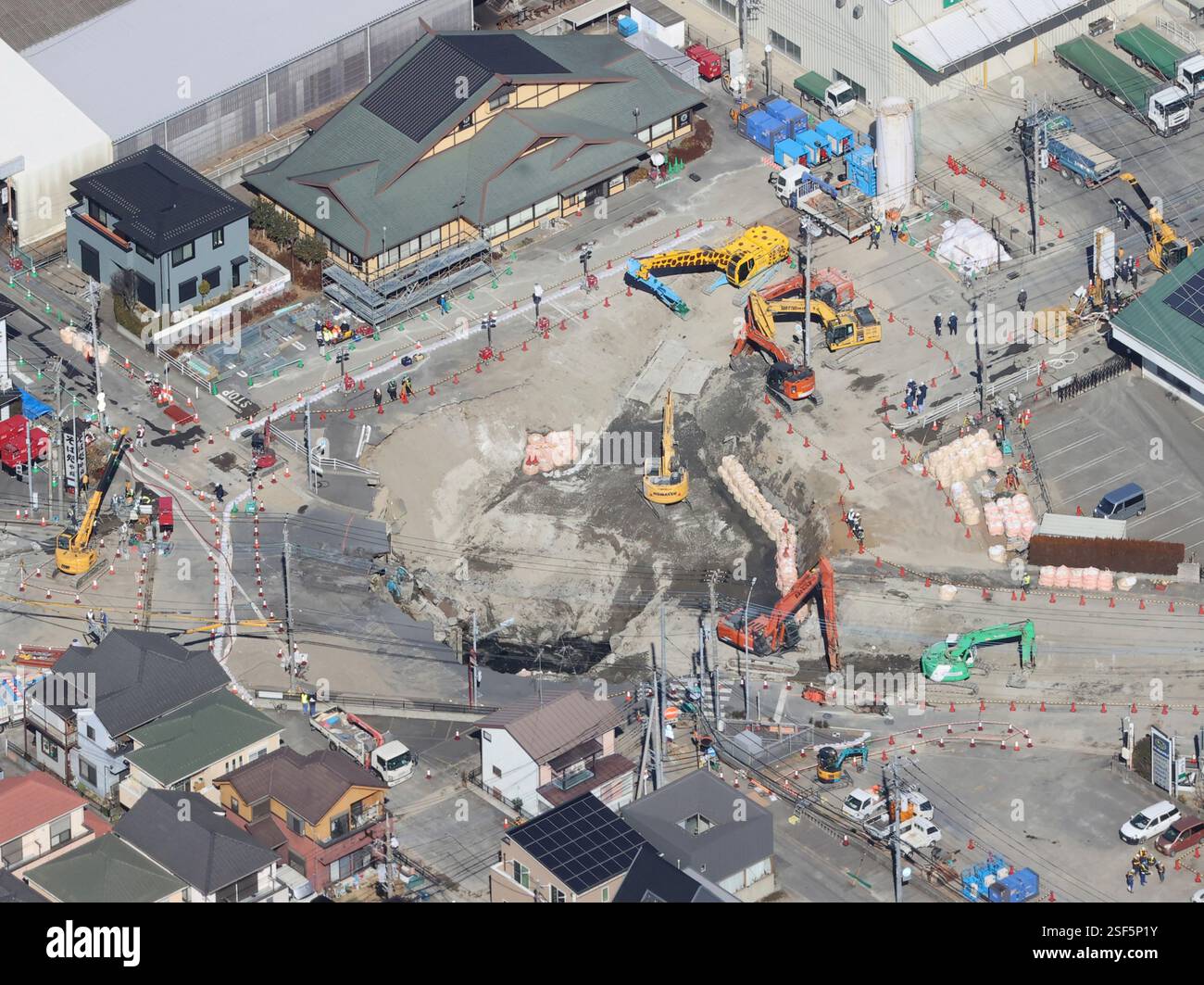 An aerial photo shows the collapsed site of a prefectural road waiting ...
