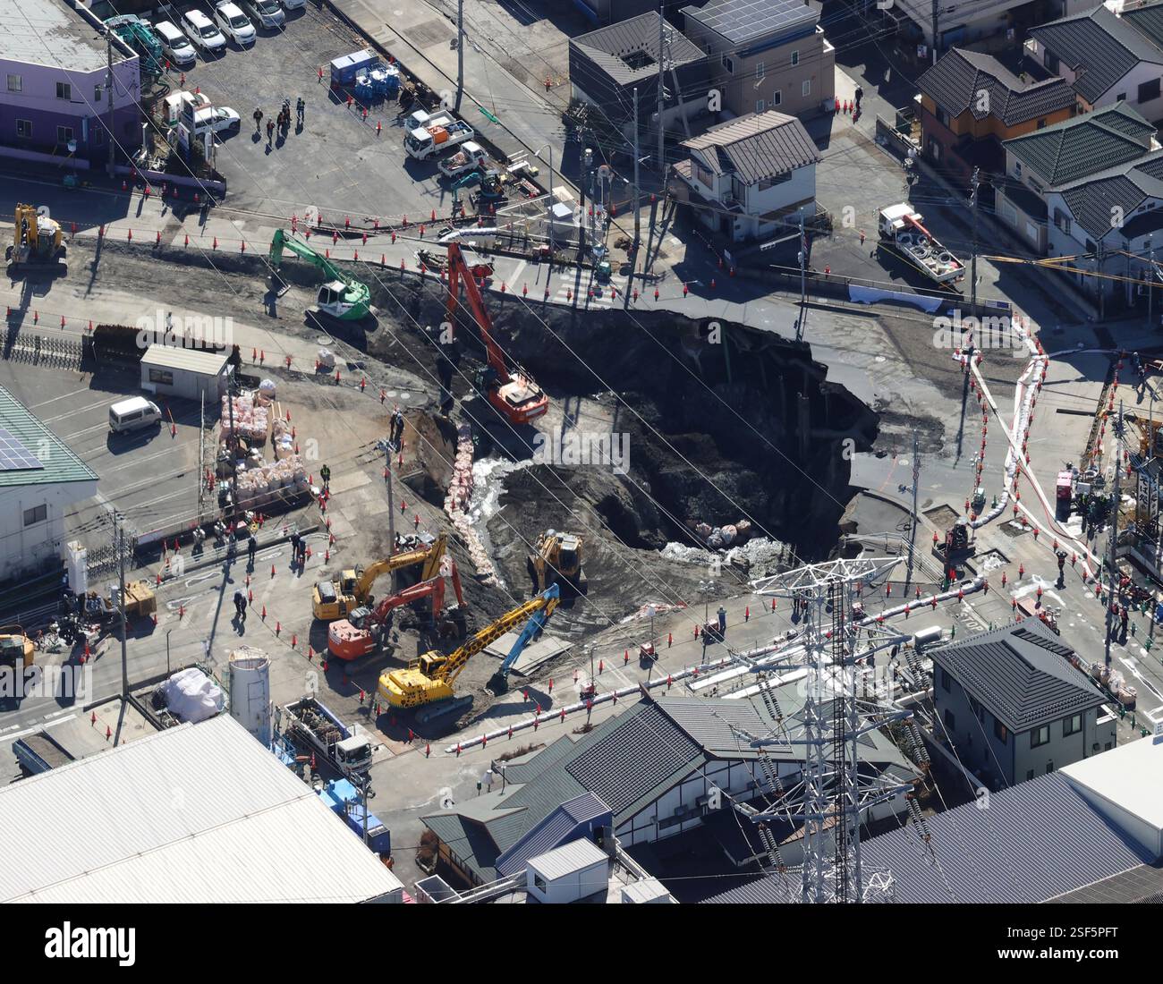 An aerial photo shows the collapsed site of a prefectural road waiting ...