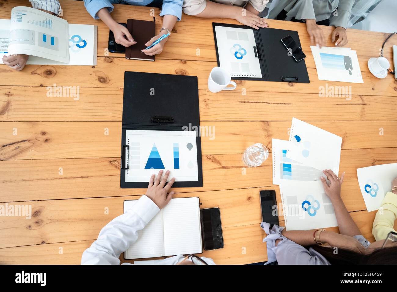 Employees Meeting in conference room. There are triangular diagrams ...