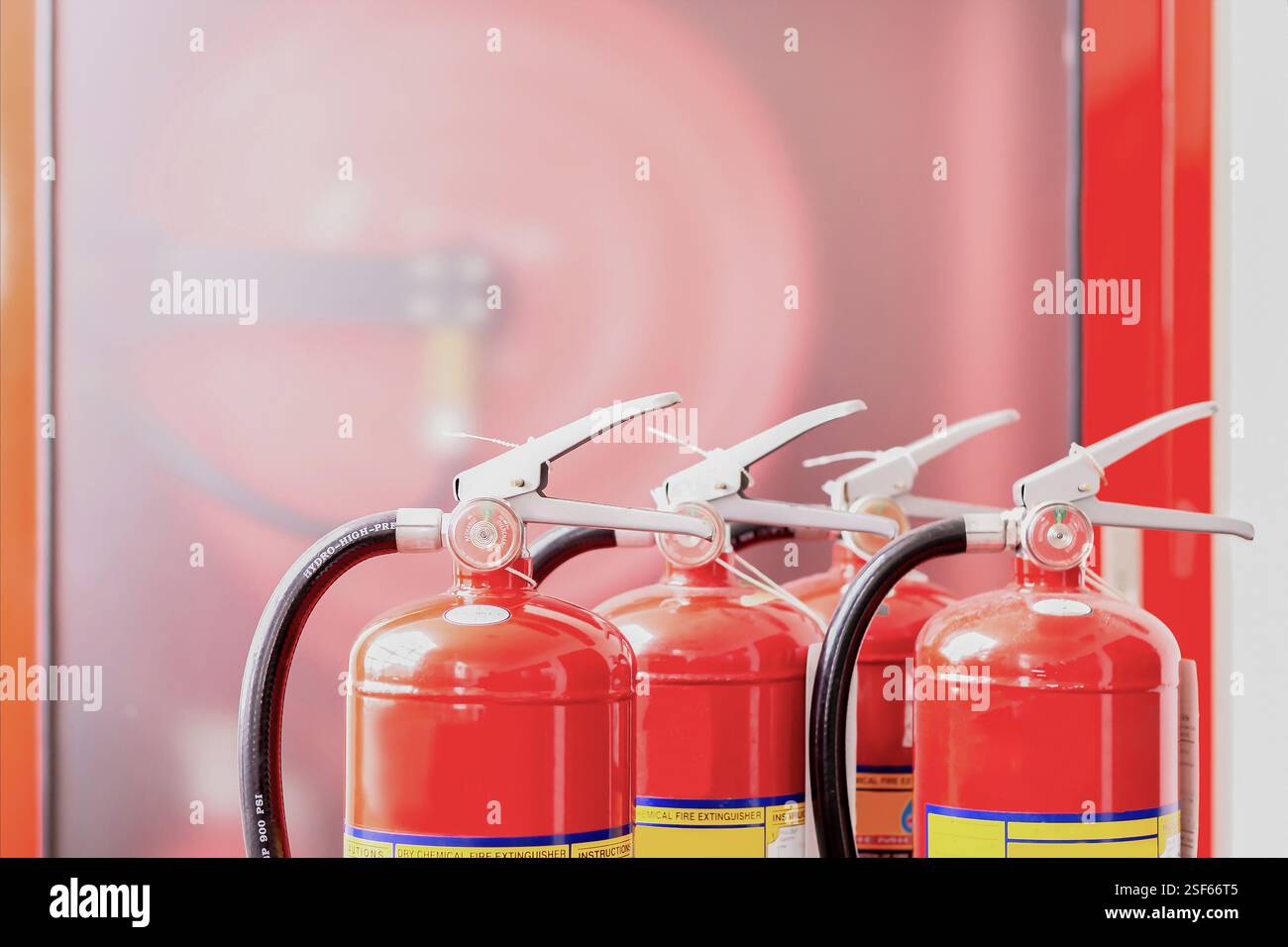 The red fire extinguisher is ready for use in case of an indoor fire ...