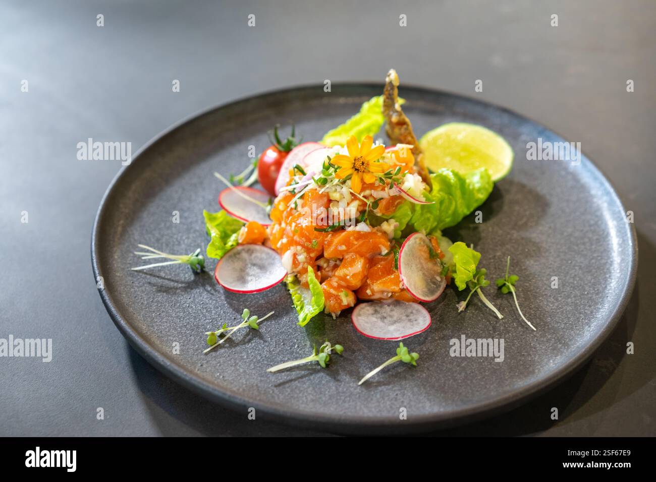 Spicy Raw Salmon Salad Thai food style decorated with Crispy fried fish ...