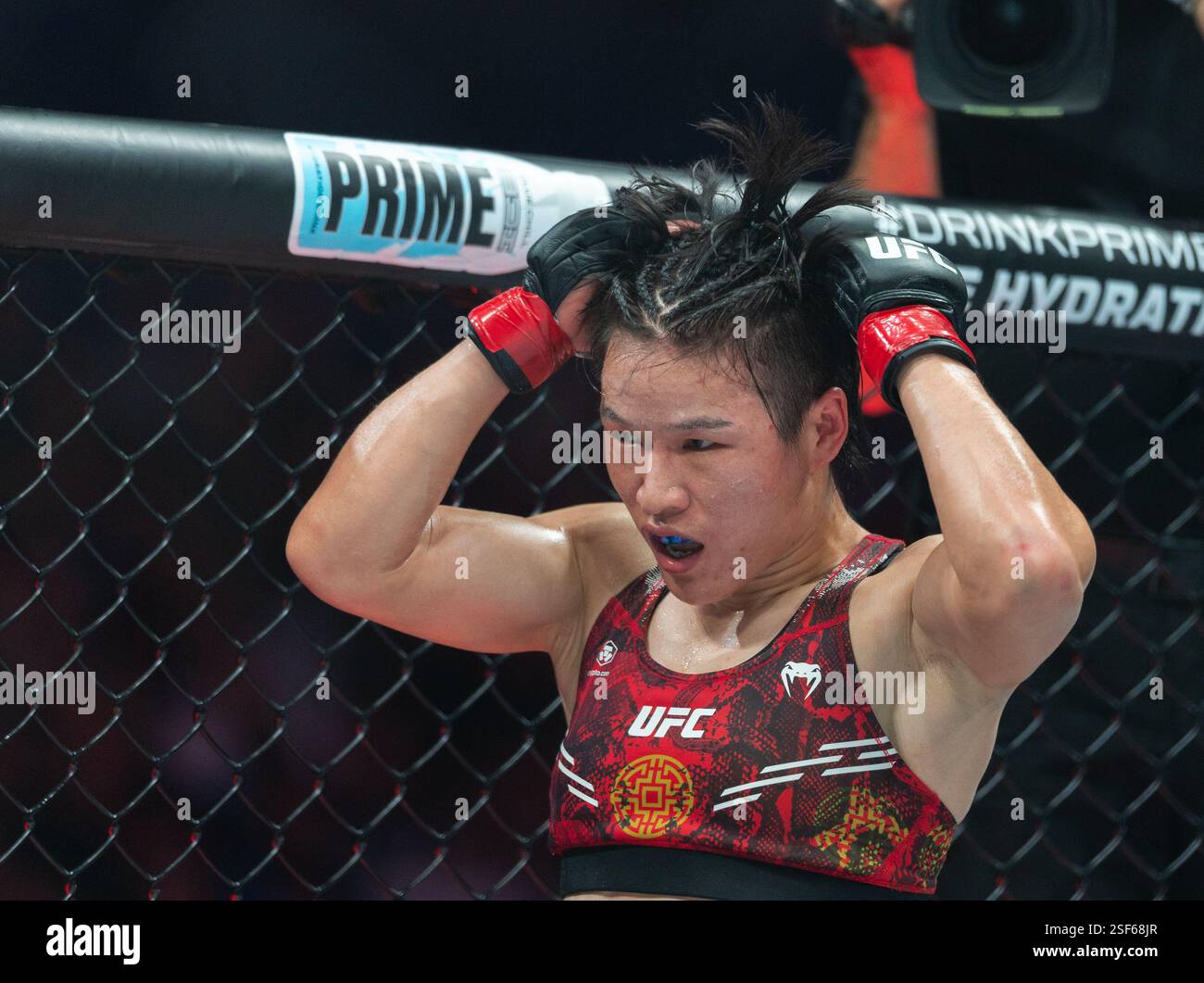 Sydney, Australia. 9th Feb, 2025. Zhang Weili of China reacts during ...