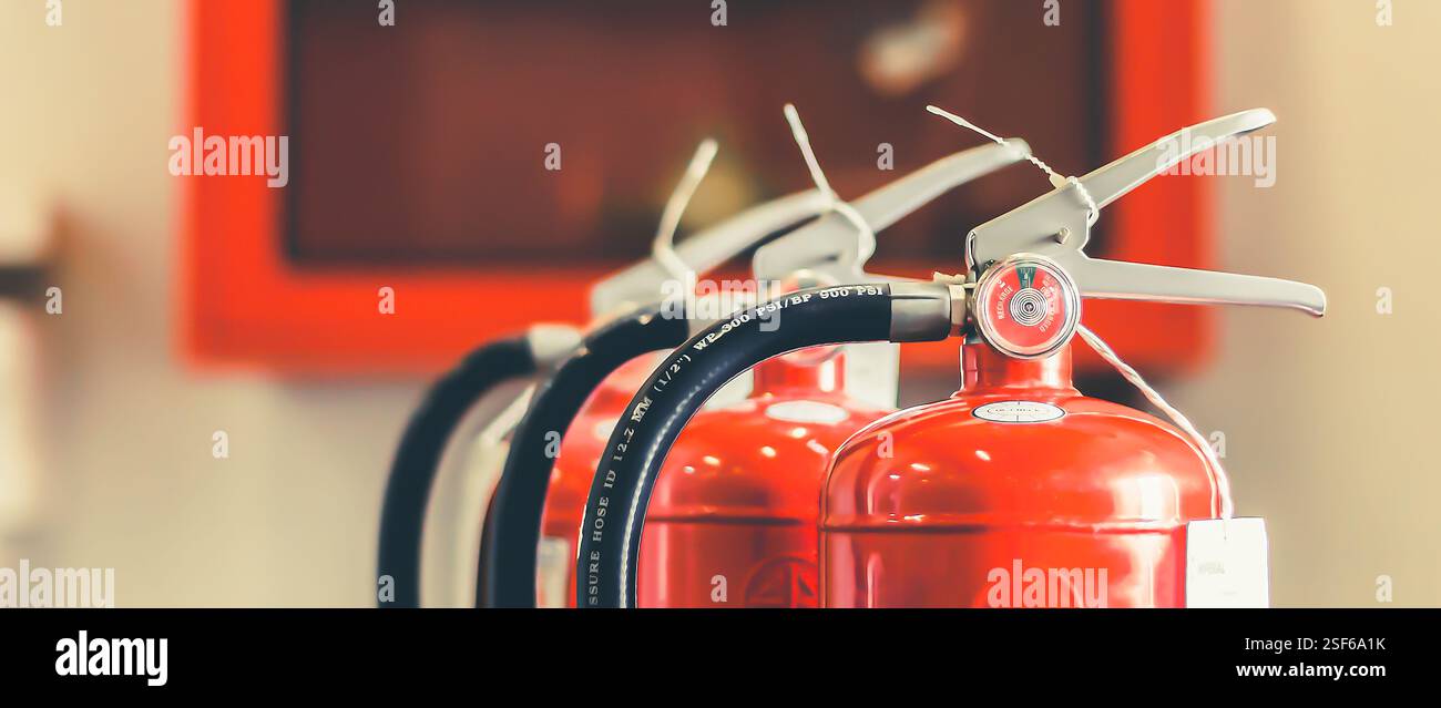 The red fire extinguisher is ready for use in case of an indoor fire ...