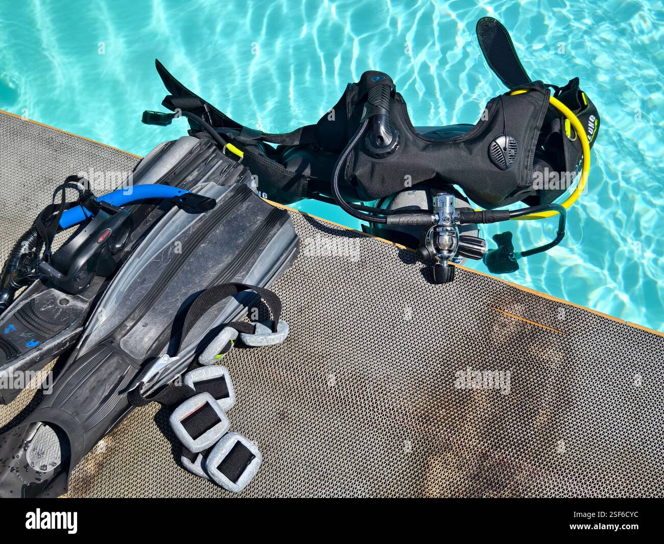 The ready for use scuba divers gear is on the pool edge Stock Photo - Alamy