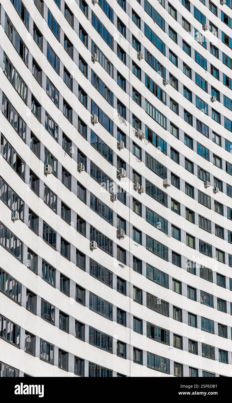 Modern residential building with multiple windows and air conditioning ...