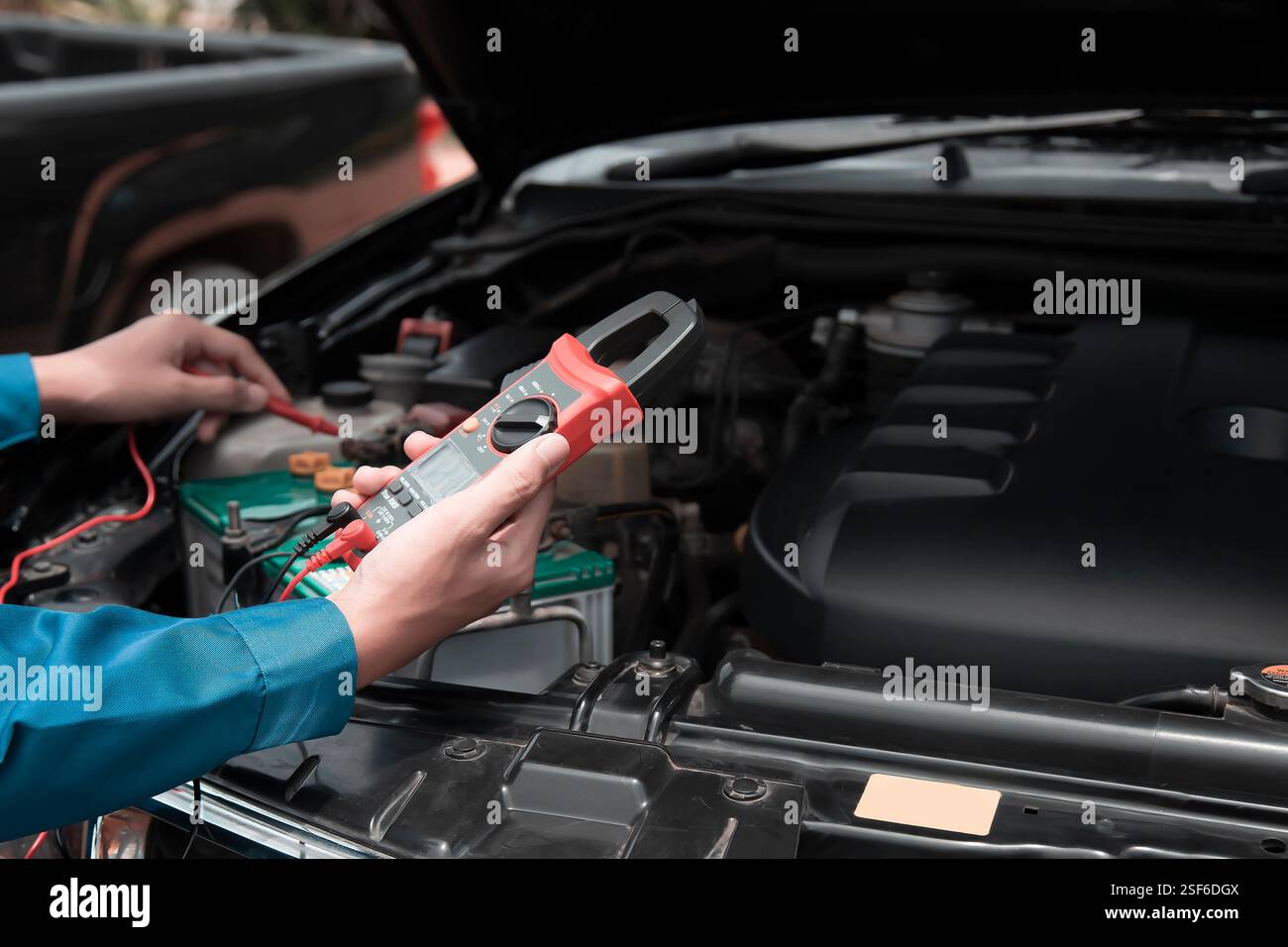 Female checking machine battery hi-res stock photography and images - Alamy
