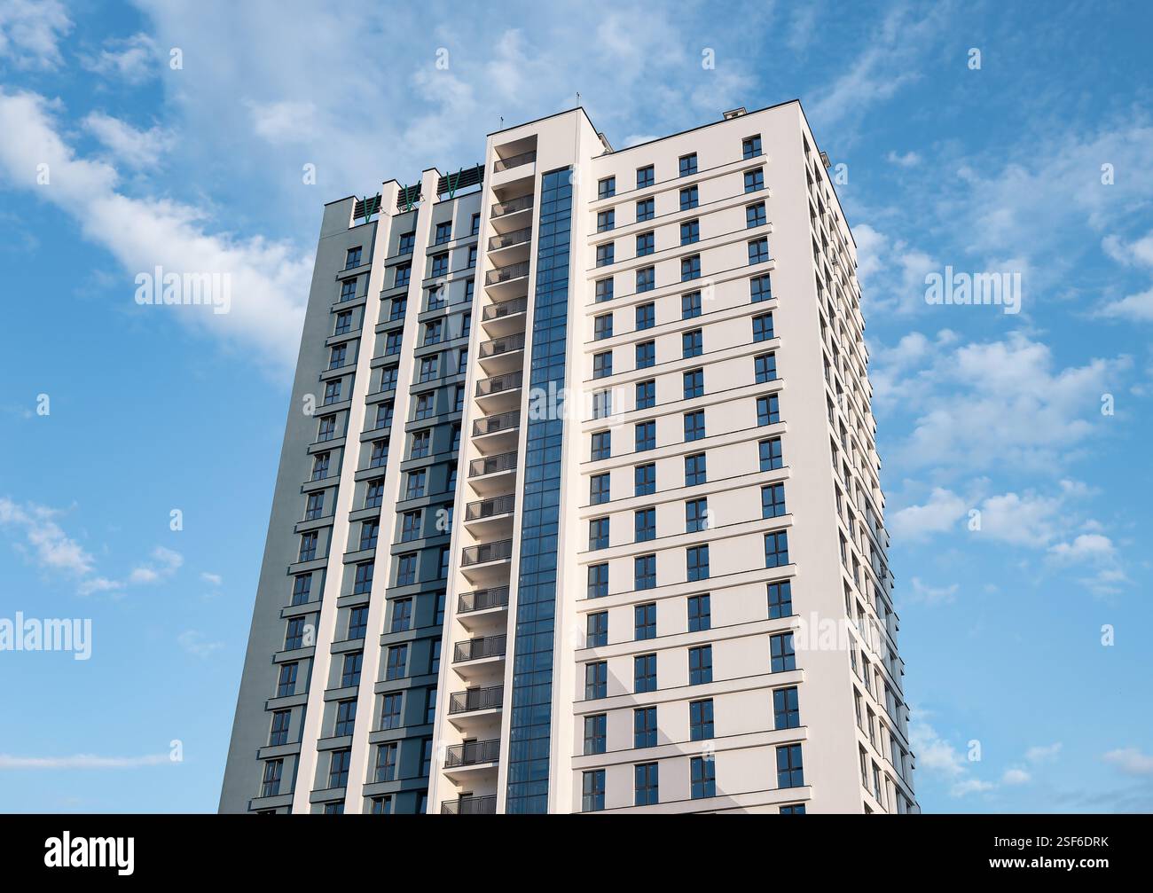 Modern high-rise condominium with sleek facades and large windows ...