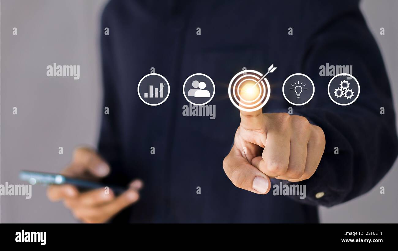 Business marketing position concept, businessman holds dart board icon ...