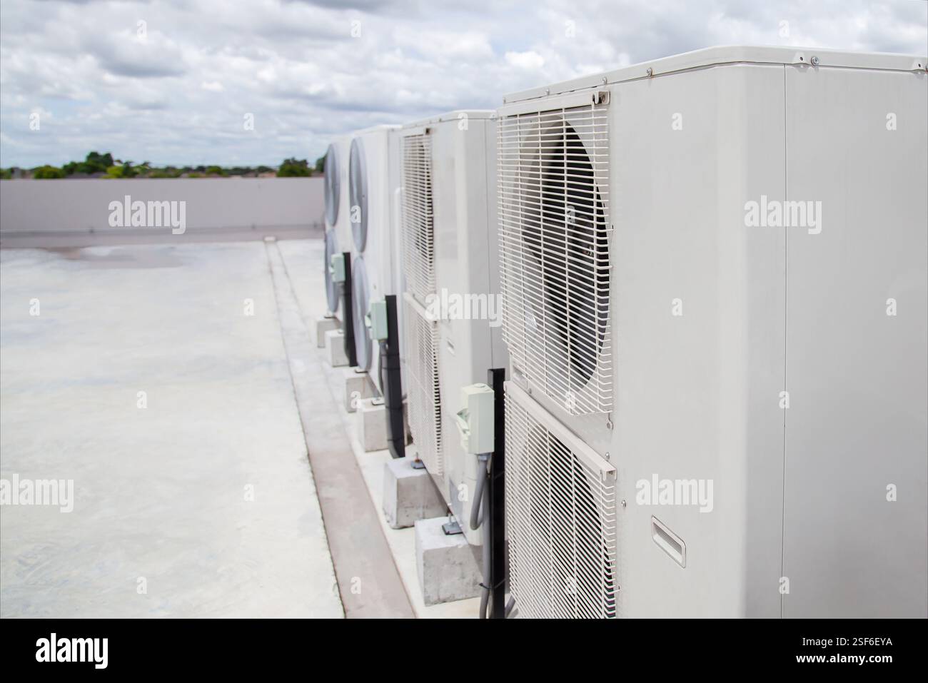 Air conditioning (HVAC) on the roof of an industrial building with blue ...