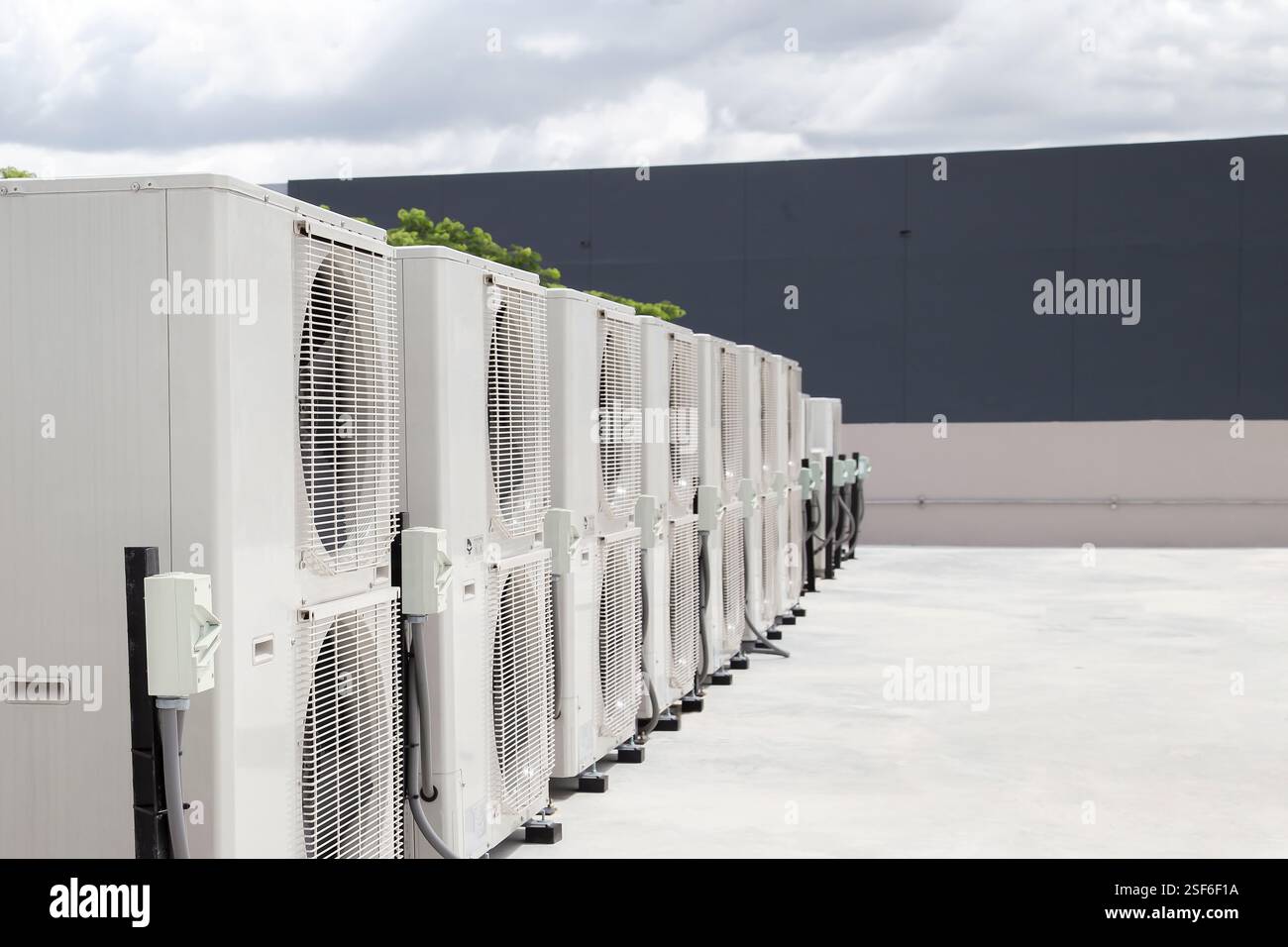 Air conditioning (HVAC) on the roof of an industrial building with blue ...