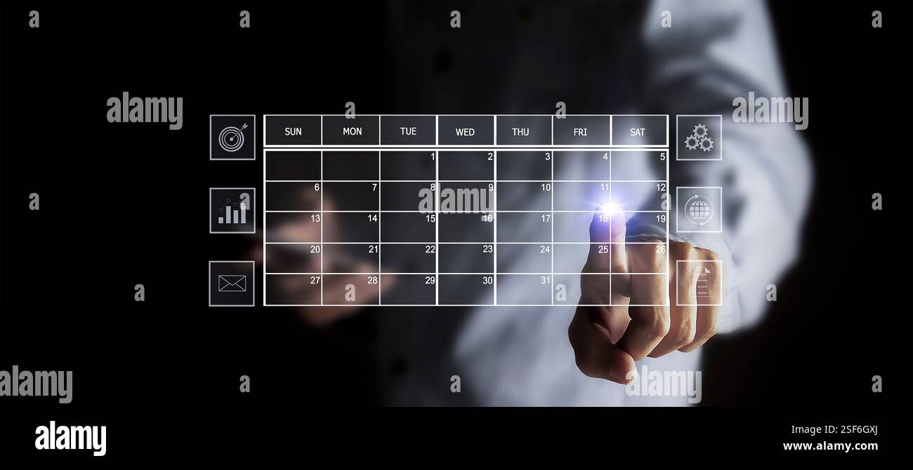 Businessman uses index finger to set agenda on calendar as appointment ...