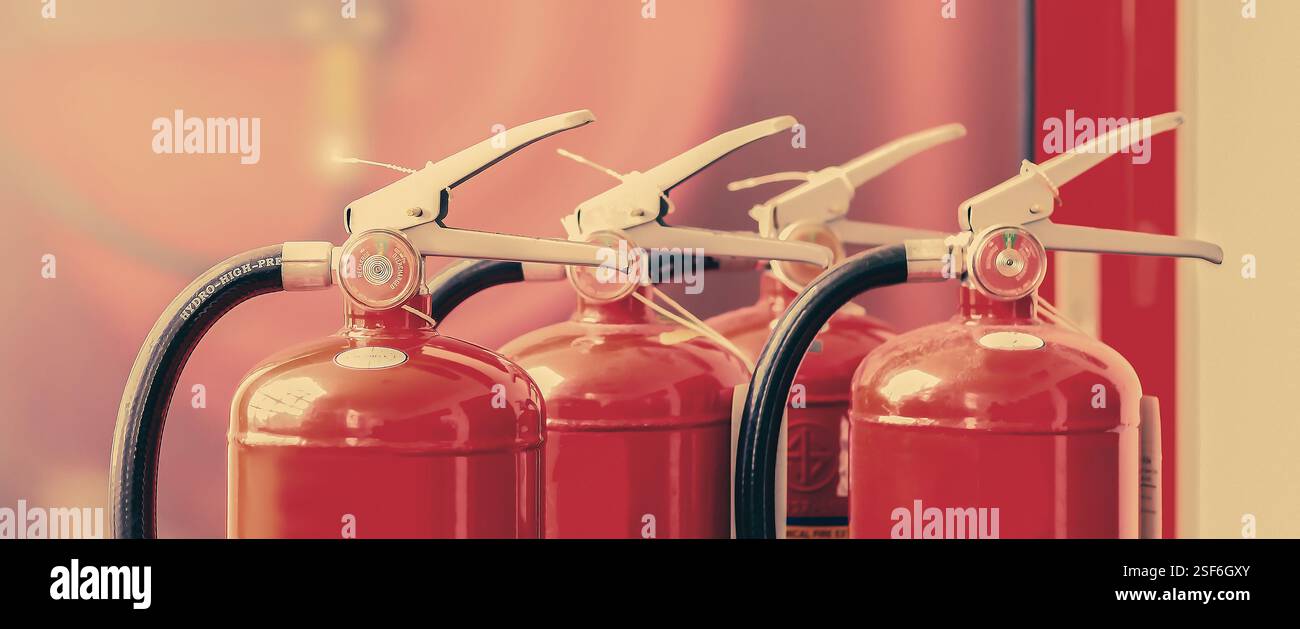 The red fire extinguisher is ready for use in case of an indoor fire ...