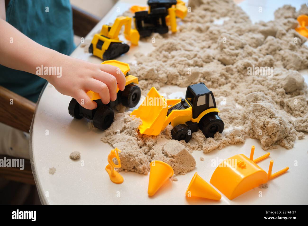 Indoor play with kinetic sand helps in the child's education and ...