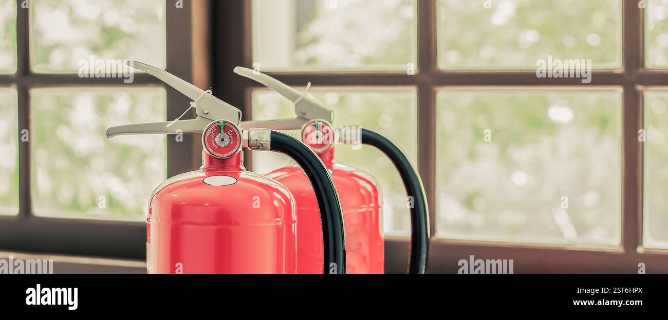 The red fire extinguisher is ready for use in case of an indoor fire ...