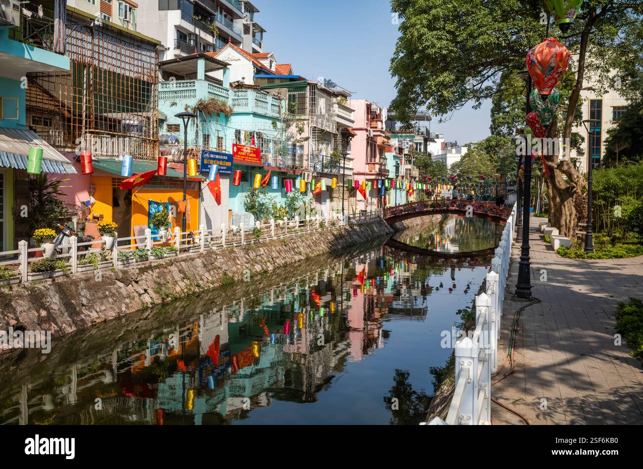 Colourful lanterns and decorated painted houses along the Truc Bac lake ...