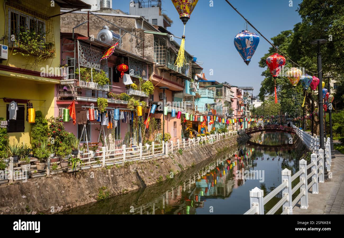Colourful lanterns and decorated painted houses along the Truc Bac lake ...
