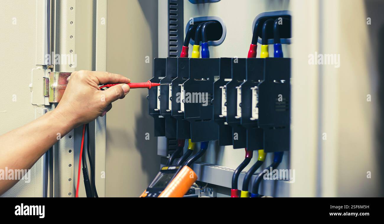 Electrician engineer work tester measuring voltage and current of power ...