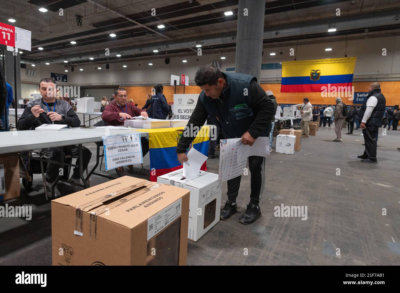 A man casts his vote in an electoral polling station. Nearly 190,000 ...