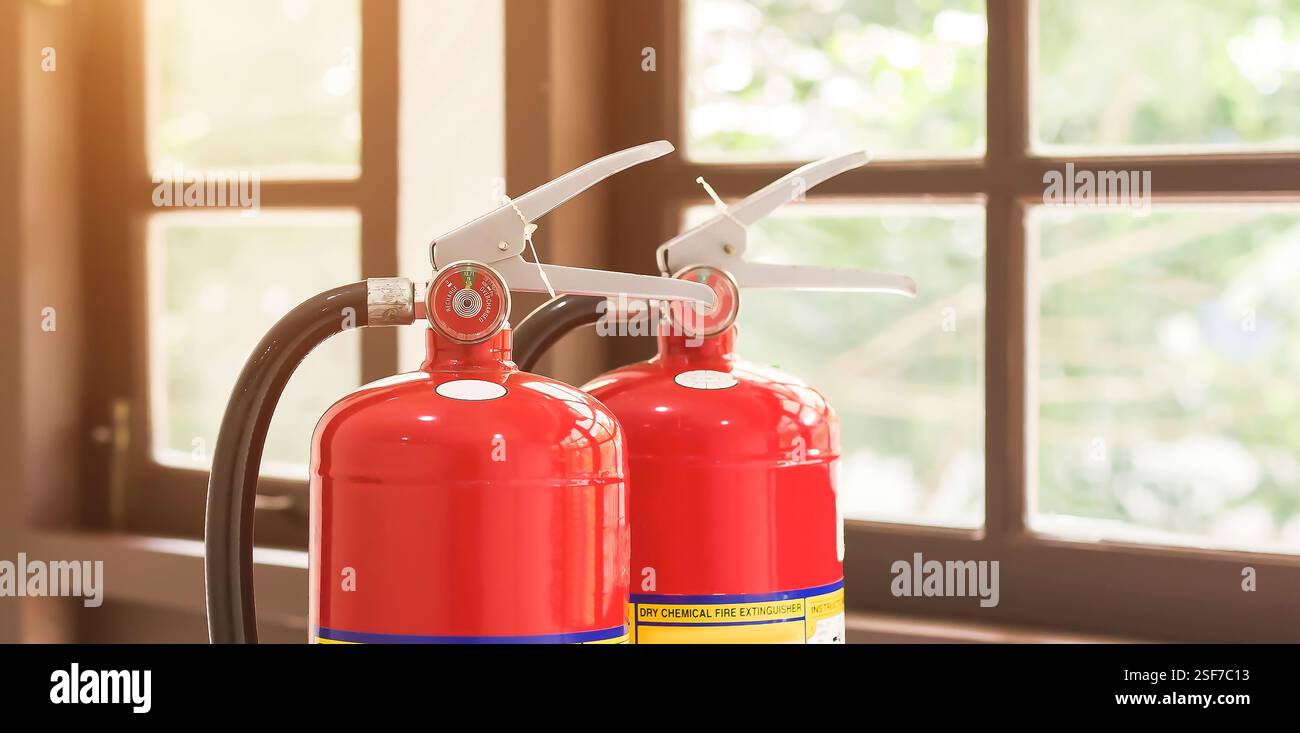 The red fire extinguisher is ready for use in case of an indoor fire ...