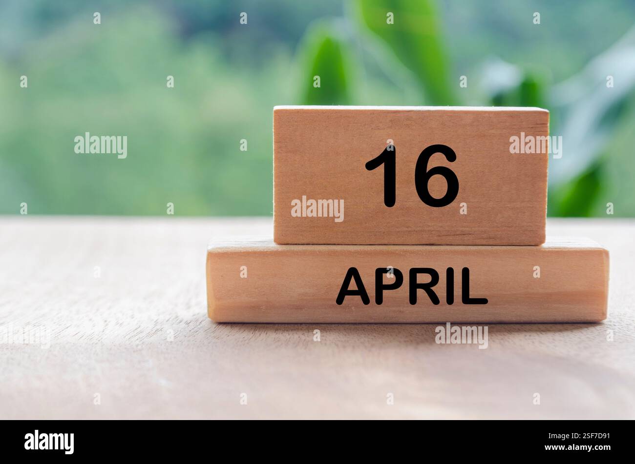 April calendar on wooden table with customizable space for text, ideas ...