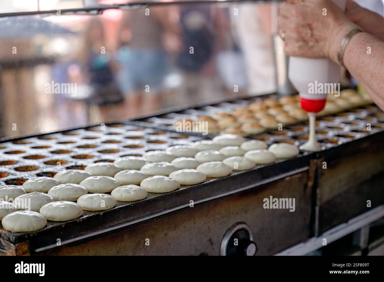 Poffertjes, traditional dutch pancakes, street food market stall ...