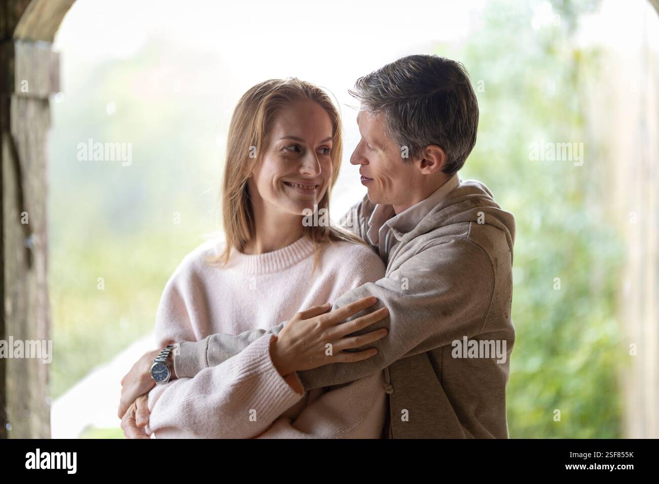 Romantic couple embracing at home, expressing love and affection Stock ...