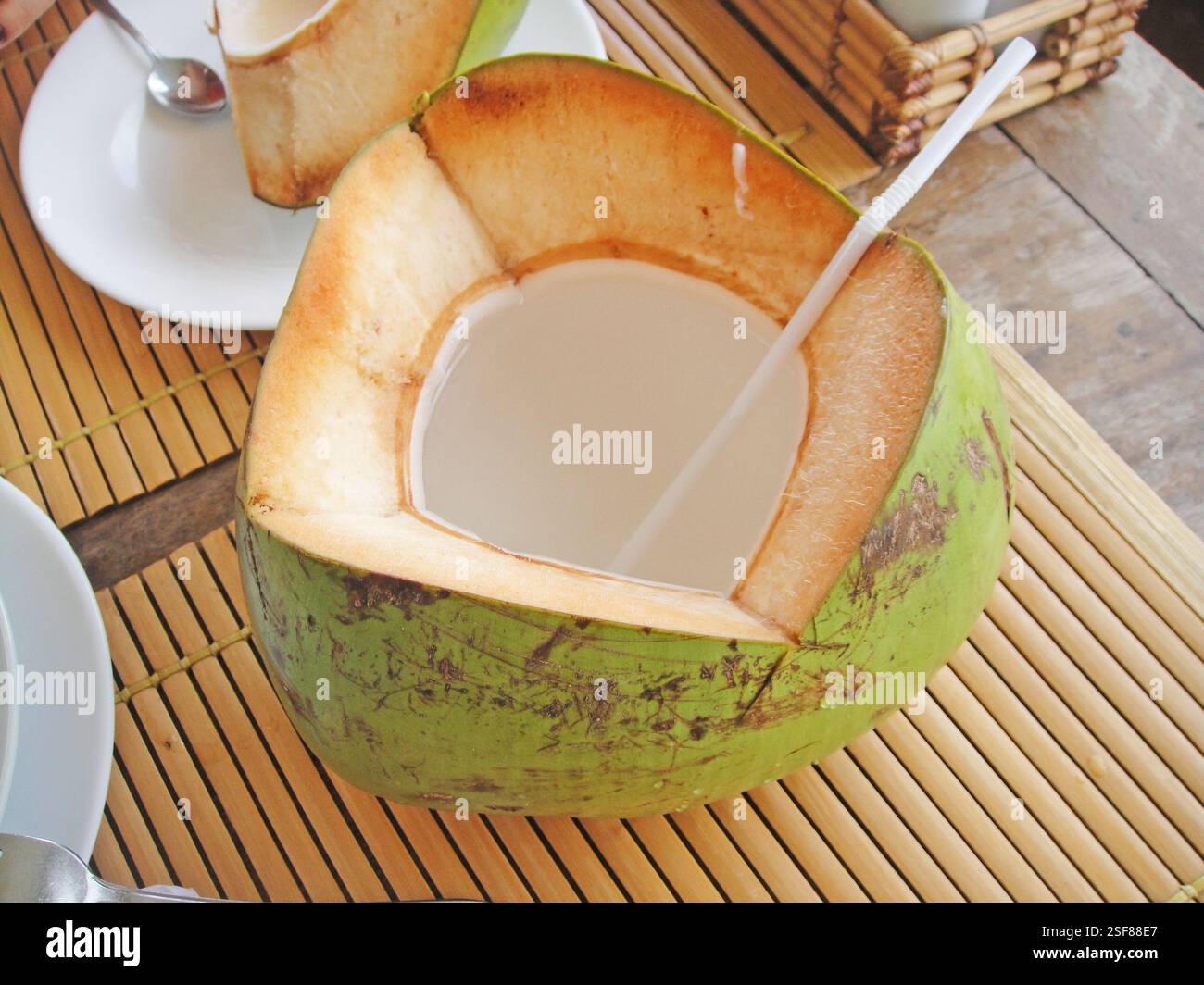 Coconut water in the coconut pot in the Philippines Stock Photo - Alamy