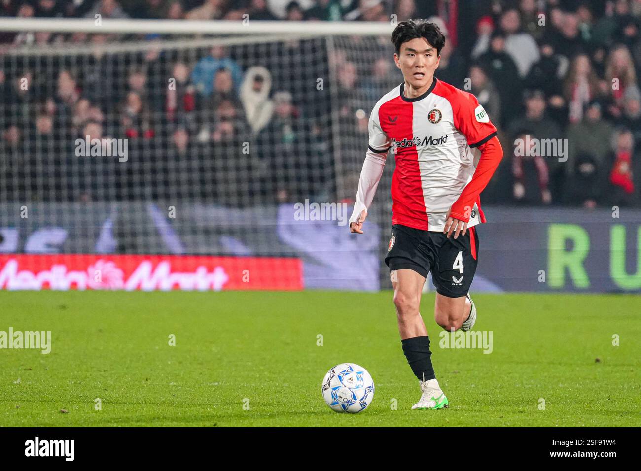 ROTTERDAM, NETHERLANDS - FEBRUARY 8: Inbeom Hwang of Feyenoord dribbles ...