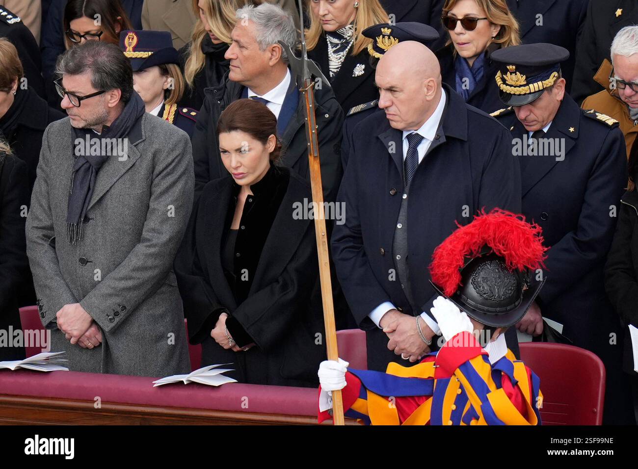 Italy's Minister of Defence Guido Crosetto, right , is flanked by his ...