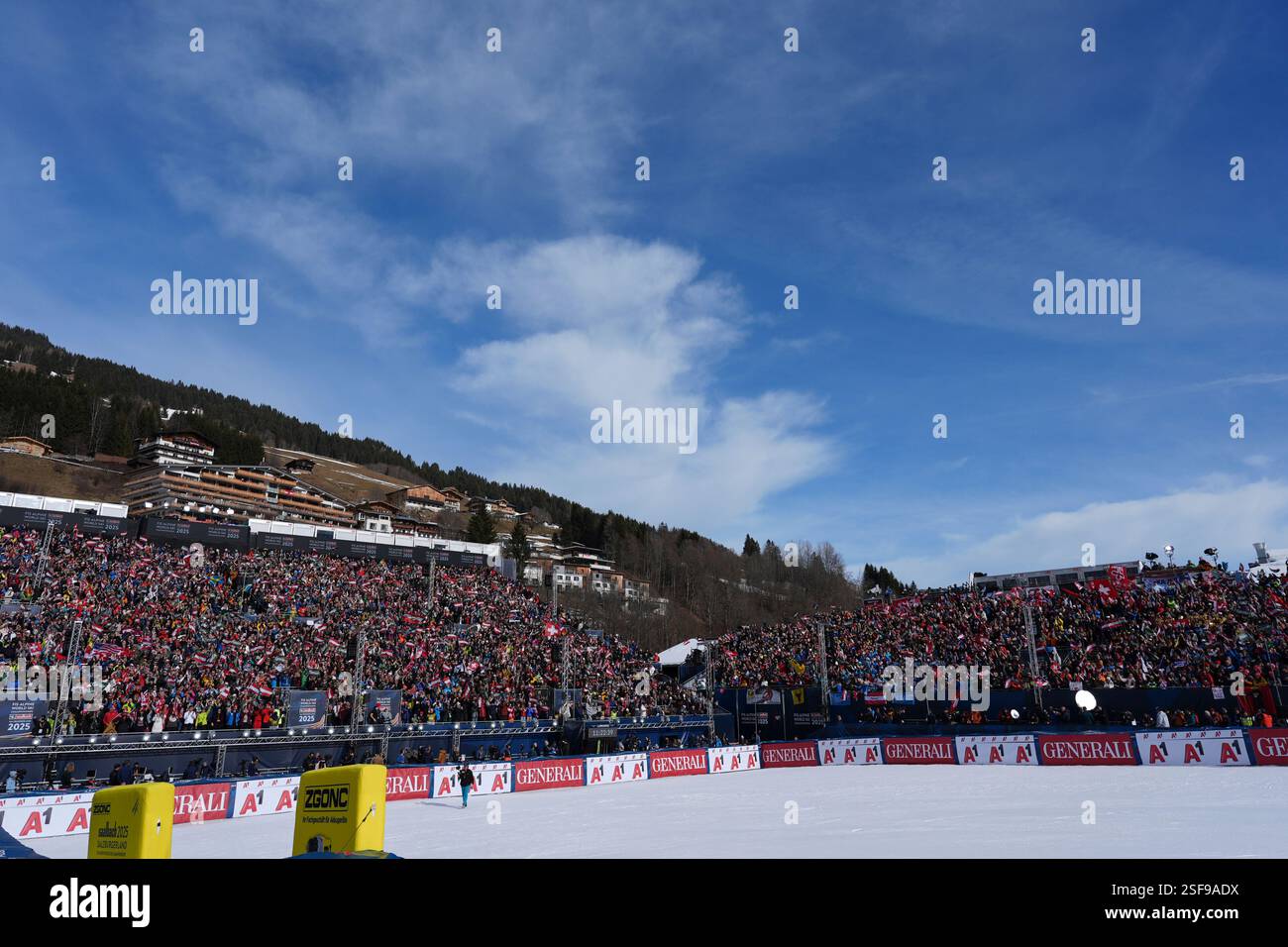 Spectators at the finish area of a men's downhill race, at the Alpine ...